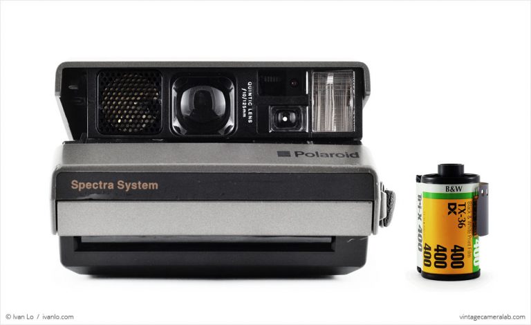 Polaroid Spectra (with 35mm cassette for scale) – Vintage Camera Lab